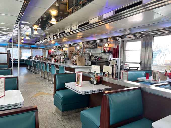 Step inside where turquoise vinyl booths and gleaming chrome create the kind of retro atmosphere that makes you want to order a milkshake immediately.