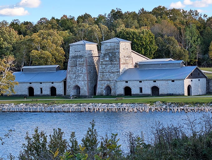 The iconic blast furnace buildings stand as silent sentinels of America's industrial past, their limestone walls holding secrets of a bygone era.