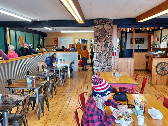 Inside, wooden floors and eclectic decor create a welcoming space where comfort food meets laid-back Minnesota hospitality.