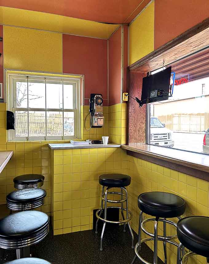 Step inside where yellow tiles and vinyl stools create a time machine powered by bacon grease and the kind of charm money can't buy.