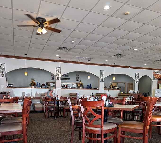 The spacious dining room invites you to settle in and stay awhile, with comfortable seating and a welcoming atmosphere that feels like home.