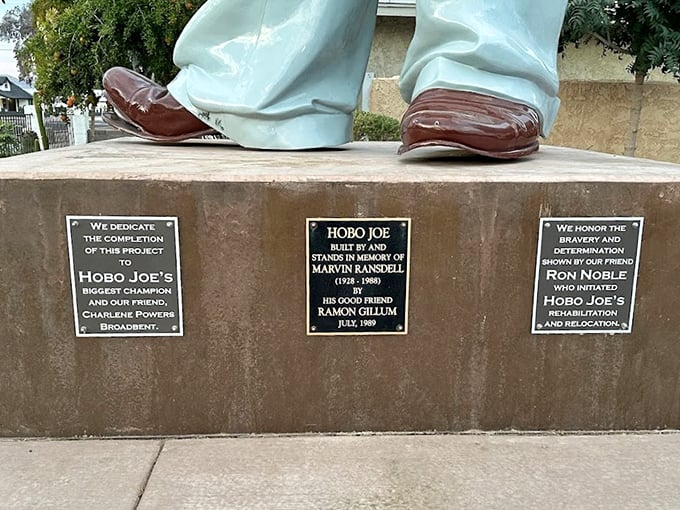 Feet of clay? Not our Hobo Joe! His sturdy base tells a tale of community spirit and dedication. It's like reading the credits of a heartwarming small-town sitcom.