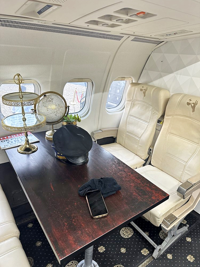 Inside this sleek aircraft, vintage airline seats and brass accents create an atmosphere that's more luxury lounge than economy class.