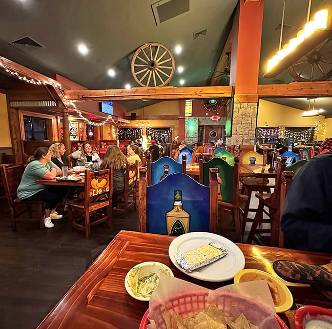 Inside: Warm wooden beams, colorful accents, and twinkling string lights create that perfect "I'm somewhere special" feeling without trying too hard.