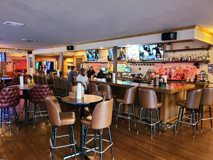 Step into flavor town! This cozy bar area is where BBQ dreams come true, and diet plans go to die. Resistance is futile, my friends.