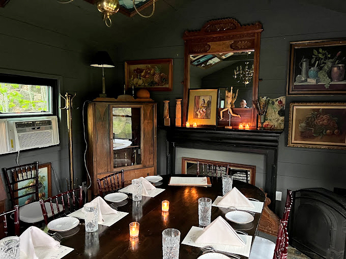 Step into a dining room that feels like it was decorated by woodland creatures with impeccable taste. Rustic charm meets sophisticated elegance in this cozy, candlelit space.