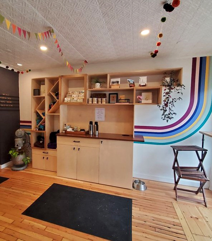Colorful bunting and rainbow stripes create a cheerful interior that's as warm and inviting as the freshly baked treats.