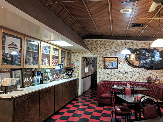 Step inside to a world where red vinyl booths and checkered floors tell stories of countless family gatherings and satisfied appetites.