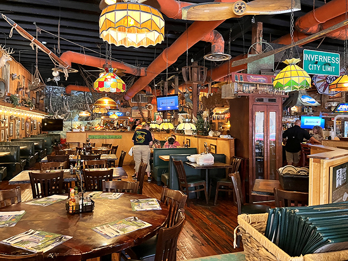 Stained glass lamps cast a warm glow over wooden tables while fishing memorabilia transforms dining into an adventure. Florida's soul captured indoors!