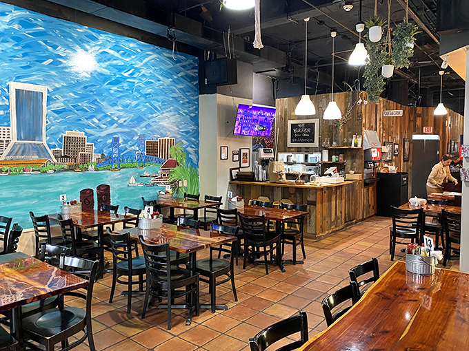 A vibrant mural of Jacksonville's waterfront creates the perfect backdrop for diners, while rustic wood accents add warmth to this cozy kosher haven.