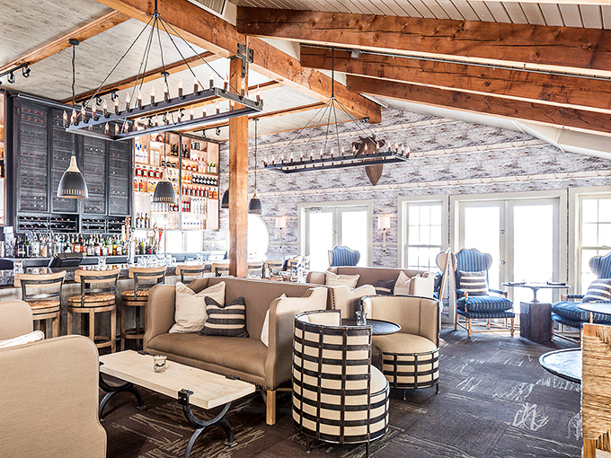 Exposed beams meet nautical elegance in this dining room where comfort reigns supreme and every seat feels like the captain's table.