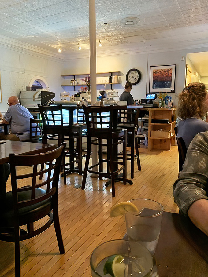 Warm wooden floors and pressed tin ceilings create an atmosphere that's both elegant and comfortable, like dining in a beloved friend's home.