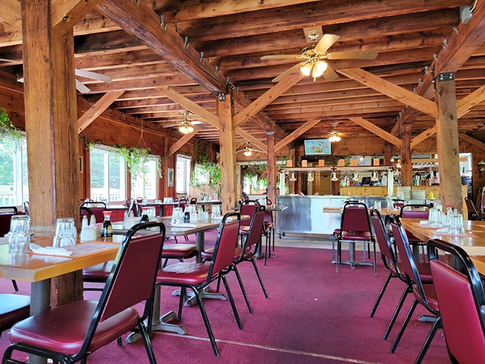 Rustic wooden beams frame this cozy dining space, where simplicity reigns and the focus stays squarely on the food.