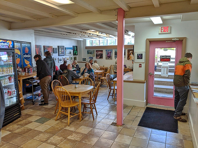 Inside, wooden tables and local artwork create a welcoming atmosphere where locals and visitors alike gather for morning indulgences.