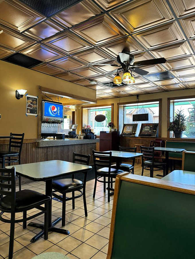 Step inside to vintage charm with decorative metal ceiling tiles, simple furnishings, and an atmosphere built on decades of good food and community.