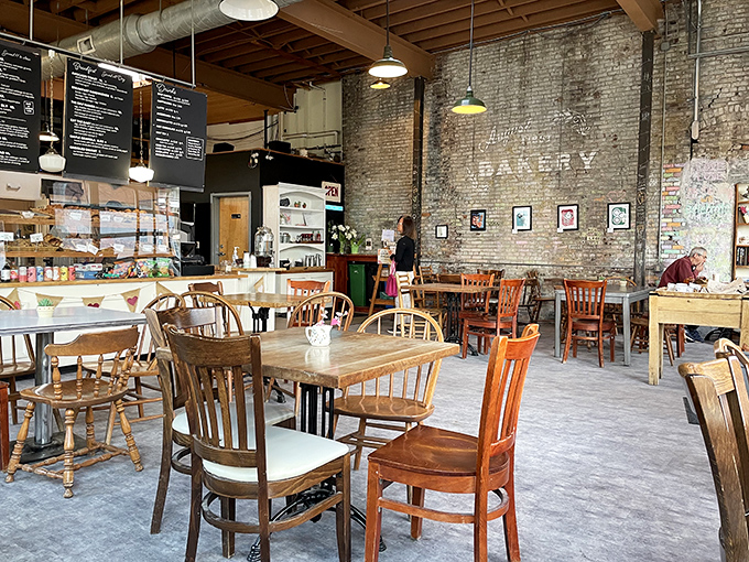 Exposed brick walls and mismatched wooden chairs create that rare atmosphere where both first-timers and regulars feel instantly at home.