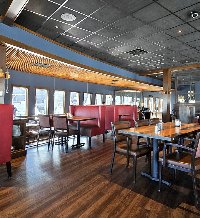 The warm, inviting interior features comfortable red booths and wooden accents, creating the perfect nautical atmosphere for savoring Maine's finest seafood creations.