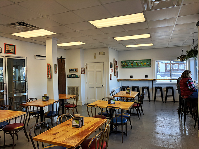 Simple wooden tables and metal chairs create an unpretentious dining space where the focus remains squarely on the exceptional food.