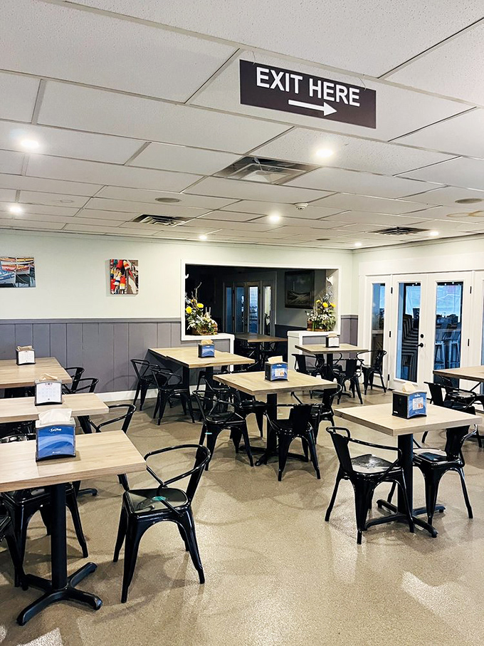 Simple, functional interior where culinary magic happens &ndash; black chairs and wooden tables let the food be the star of this unpretentious show.