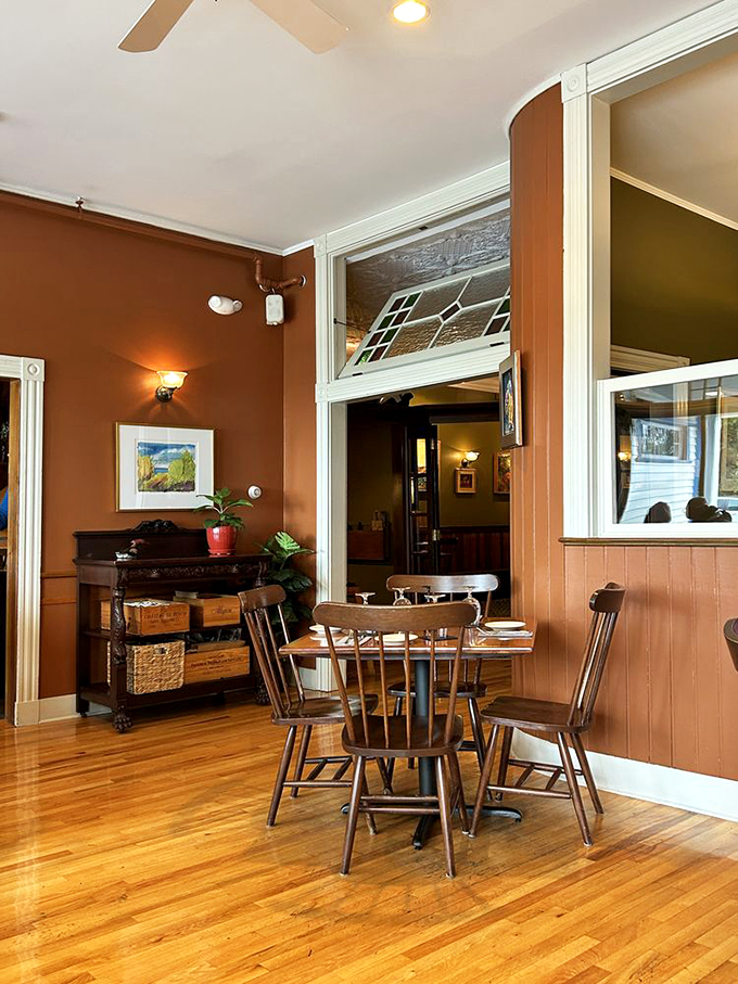 Step into warmth! This cozy nook feels like your favorite aunt's living room, if your aunt were a gourmet chef with impeccable taste in art.