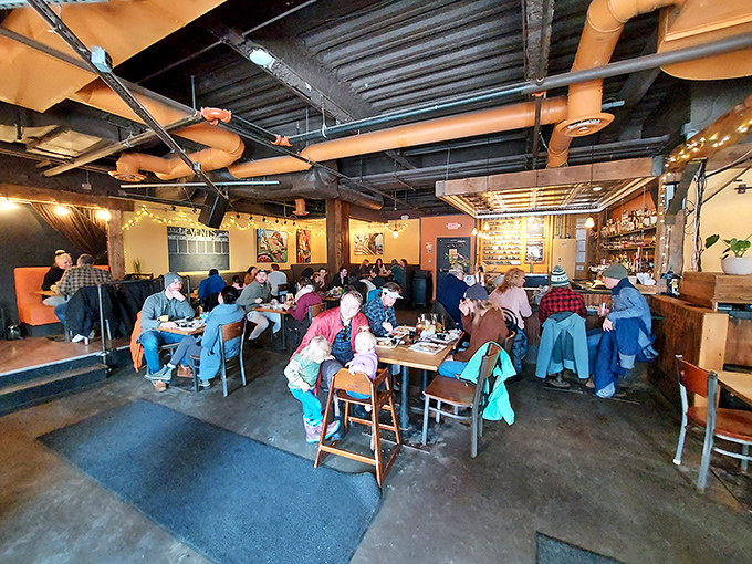 Where Brooklyn industrial meets Vermont cozy &ndash; exposed pipes overhead, warm lighting, and an atmosphere buzzing with the symphony of satisfied diners.
