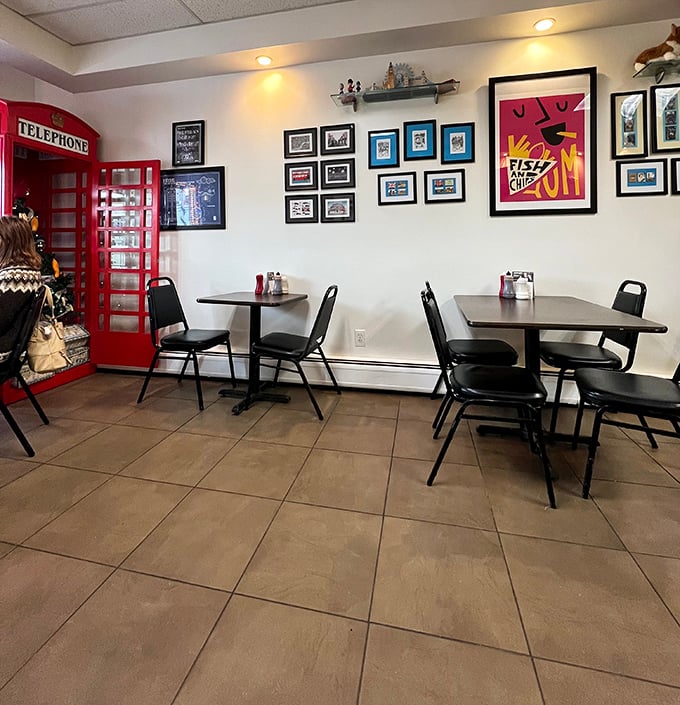 Inside, the classic red telephone booth stands sentinel in the corner, while framed photos create an atmosphere that's more authentic pub than touristy gimmick.