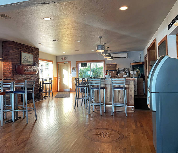 Warm wood tones and nautical touches create an inviting atmosphere inside, where the polished bar beckons with promises of island hospitality.