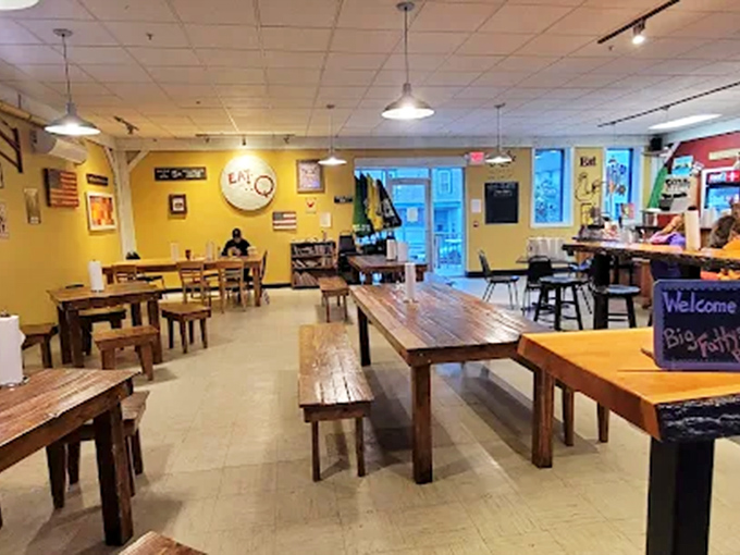 Rustic wooden tables and sunny yellow walls create the perfect backdrop for the flavor festival about to unfold on your plate.