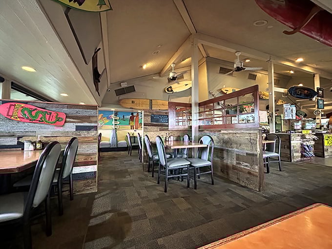 Inside, surfboards hang from the ceiling while rustic wood paneling creates the perfect blend of island charm and diner comfort.