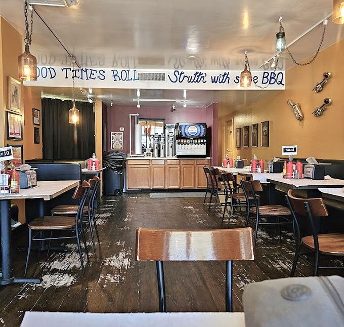 Inside Satchmo's, the worn wooden floors and simple decor tell you one thing: they're focusing on the food, not fancy frills. That banner says it all!