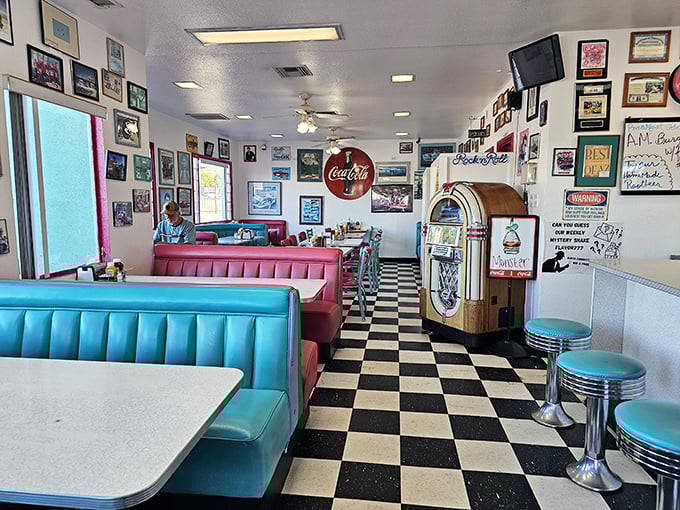 Black and white tiles dance beneath turquoise booths and a vintage jukebox &ndash; diner perfection that makes calories count as cultural experiences.