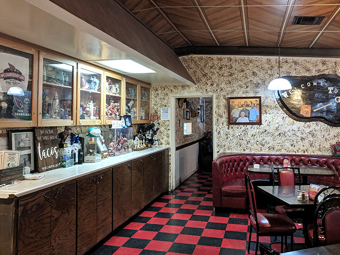 Step inside and time stands still &ndash; the classic red and black checkerboard floor paired with burgundy booths creates that rare, genuine atmosphere chain restaurants try desperately to fake.