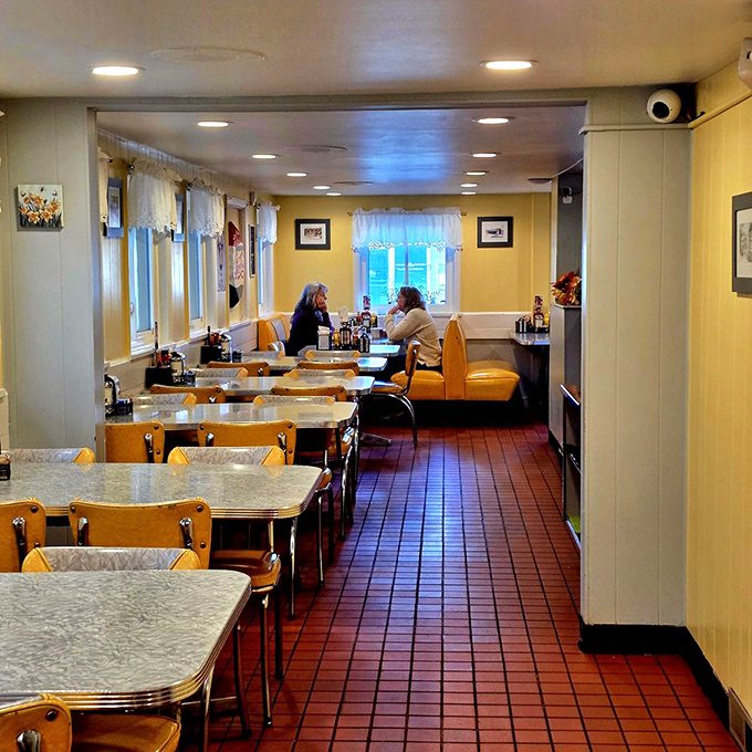 Sunshine-yellow walls and classic vinyl booths create that unmistakable diner atmosphere where time seems to slow down just enough.