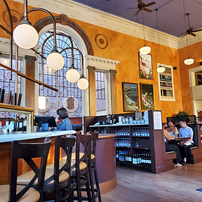 Interior: Warm ochre walls and soaring arched windows create a space that feels like a Tuscan dream. Mama mia, that's some gorgeous lighting!