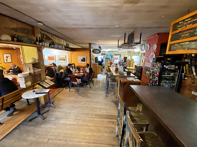 Inside, warm wooden floors and golden lighting create that authentic Vermont vibe that big-city restaurants try desperately to replicate.