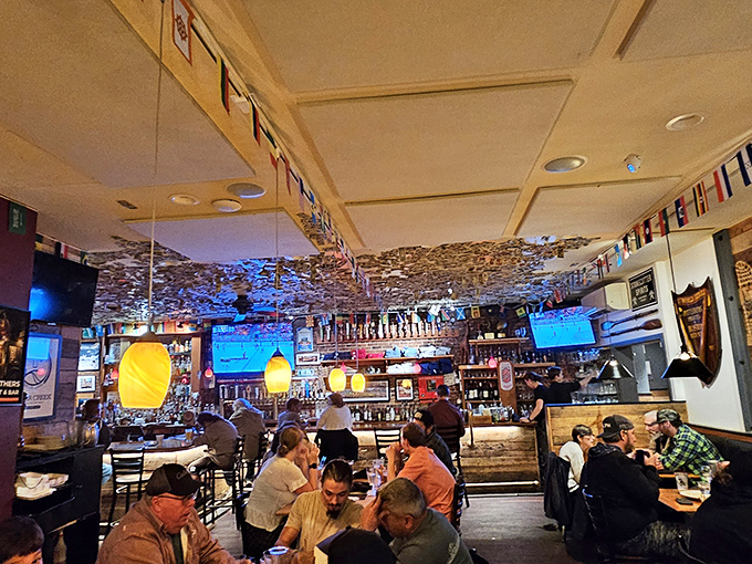 Dollar bills carpet the ceiling like a bizarre money forest, while international flags remind you that good food speaks every language.