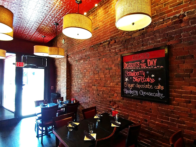 Exposed brick walls and drum shade lighting create the perfect ambiance for both first dates and family celebrations.