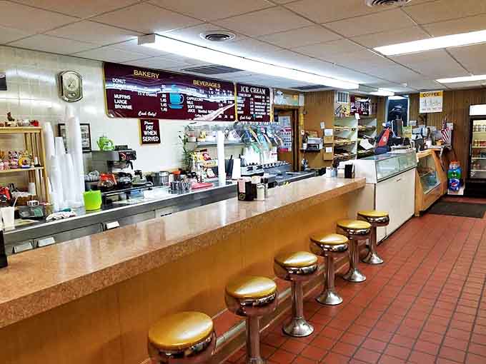 Classic counter seating with gold hamburger-style stools takes you back to simpler times when donuts and coffee were life's perfect pairing.