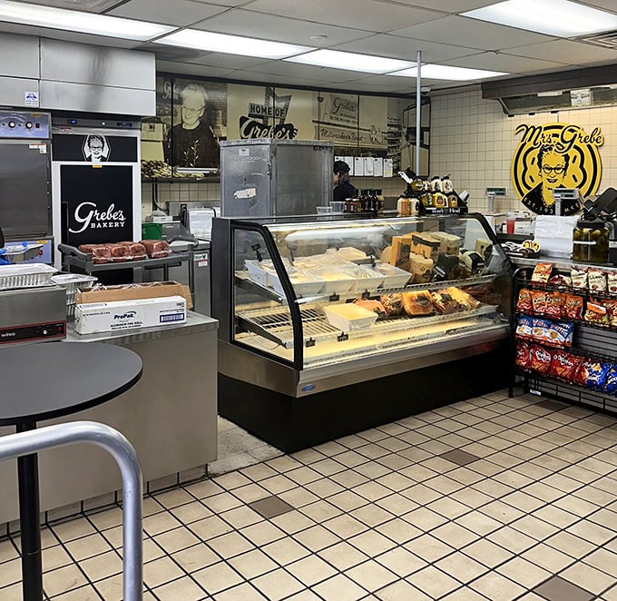 Inside the bakery, display cases gleam with temptation while vintage photos celebrate decades of donut-making mastery.