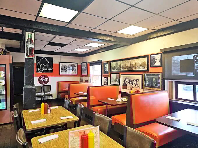 Orange booths and nostalgic decor transport diners to simpler times, where conversations flow as freely as the coffee refills.