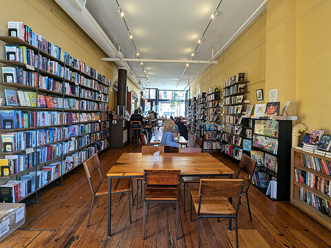 Mismatched chairs and wooden tables invite you to stay awhile, each bearing the gentle scars of countless coffee dates and reading sessions.