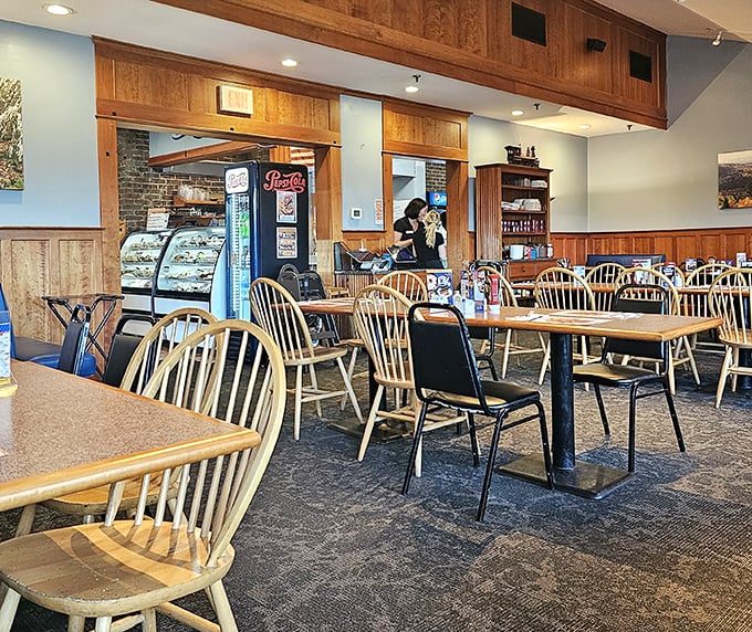 Windsor-back chairs and wooden tables create that perfect "stay awhile" atmosphere where conversations flow as freely as the coffee.
