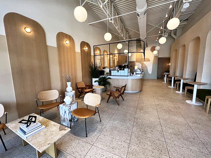 Interior: Minimalist chic meets maximum comfort in this airy space where curved wooden arches and globe lights create the perfect backdrop for sugar-induced bliss.