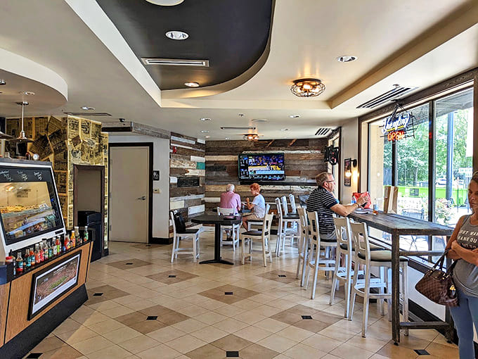 Modern meets cozy in this thoughtfully designed space where wood accents and clean lines create the perfect backdrop for sandwich artistry.