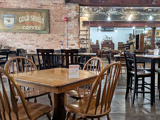 Exposed brick meets industrial chic in this inviting counter space, where baristas craft drinks amid vintage d&eacute;cor and miniature evergreens.