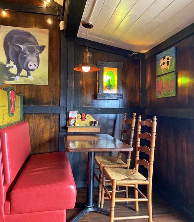 Dark wood, quirky pig art, and red vinyl booths create the perfect backdrop for Midwestern comfort food magic.