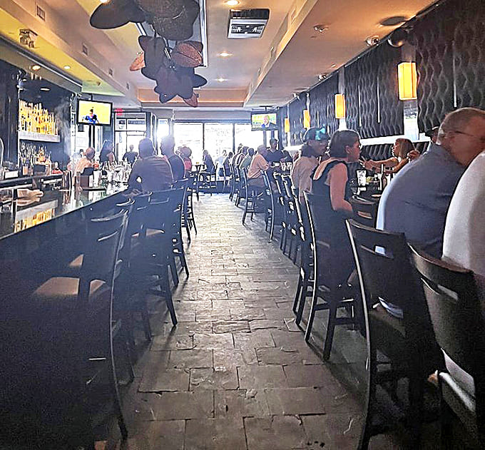 Inside, the sleek bar area balances sophistication with comfort &ndash; like your favorite jazz club decided to serve world-class seafood.