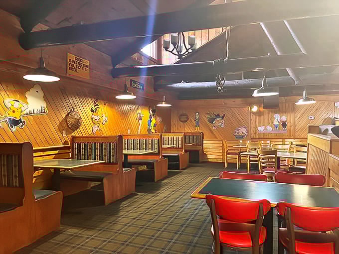 Inside, wood-paneled walls adorned with whimsical cartoon characters create a cozy, nostalgic atmosphere where conversations flow as freely as the coffee.