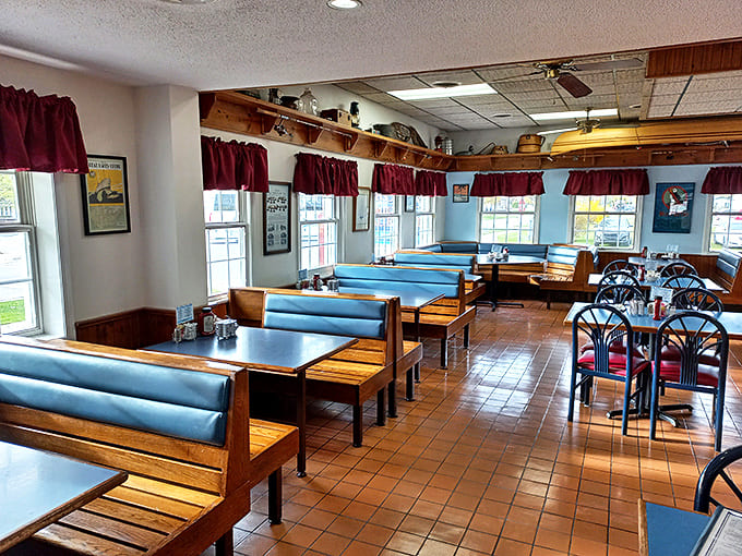 Blue booths and wooden accents create the perfect backdrop for family meals and solo dining adventures alike in this cozy dining room.