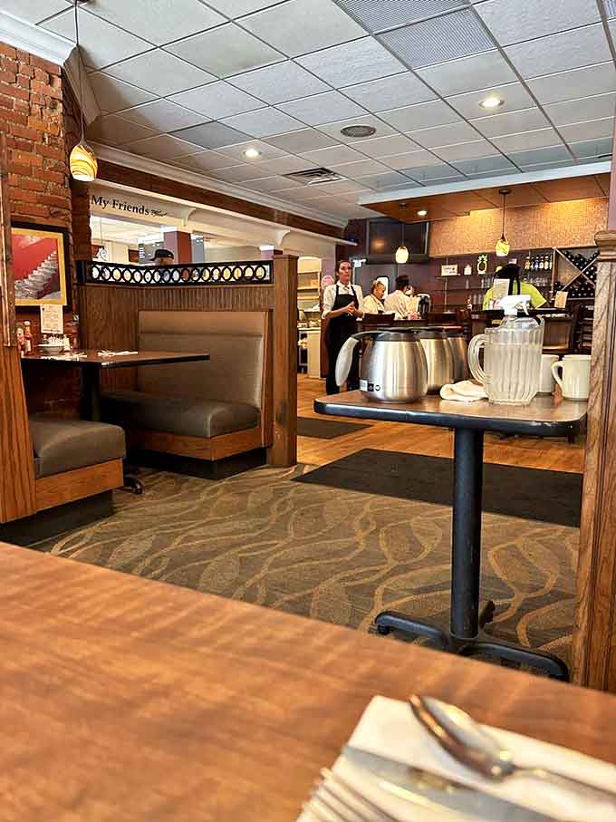 Cozy booths and warm wood tones create an inviting atmosphere where conversations flow as freely as the coffee, making strangers feel like regulars.